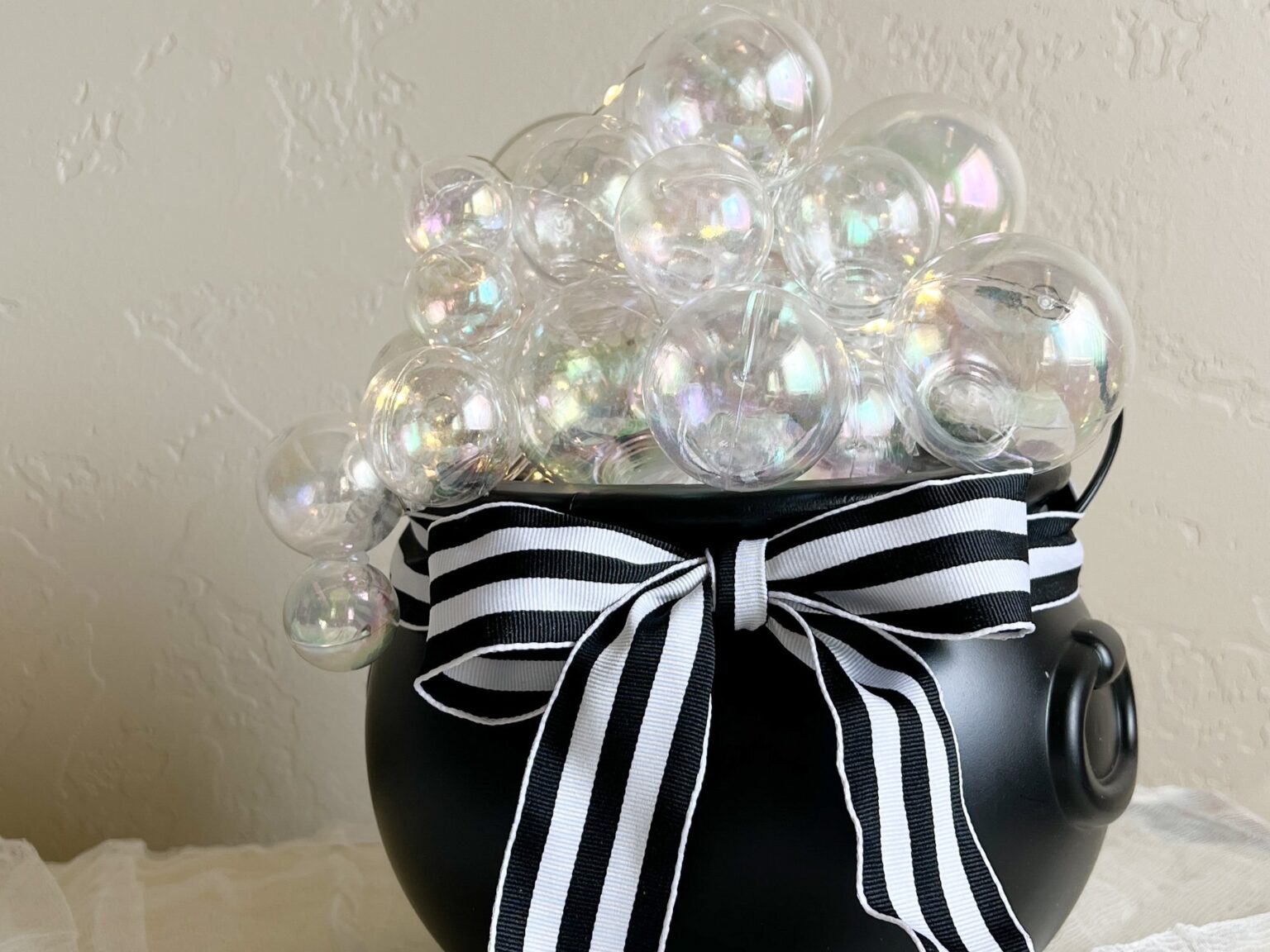 Build a bubbling cauldron with Christmas ornaments! This easy DIY takes ...