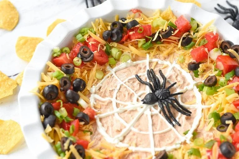 Serve up a seven-layer dip, spiderweb style! 3 Halloween treats with a ...